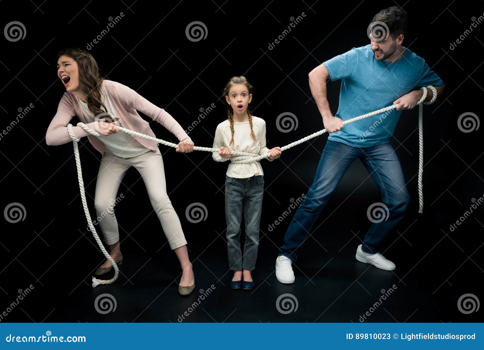 Parents Pulling Over Shocked Daughter with Rope, Stock Image - Image of ...
