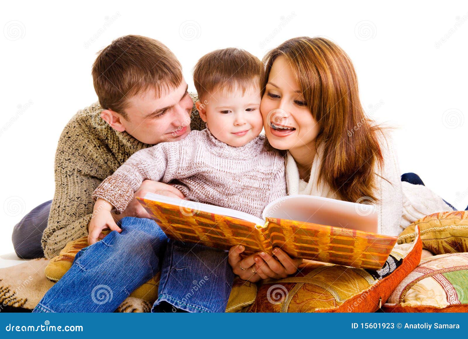 Parents Reading To Their Kid Stock Photos - Image: 15601923