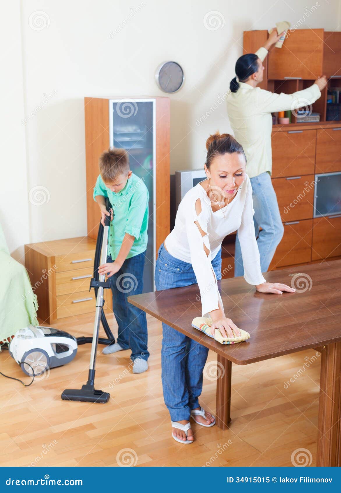 Parents with Son Dusting Together Stock Image - Image of clean, dusting ...