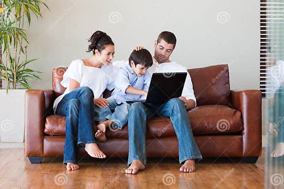Parents and Son Playing with a Laptop Stock Image - Image of game ...