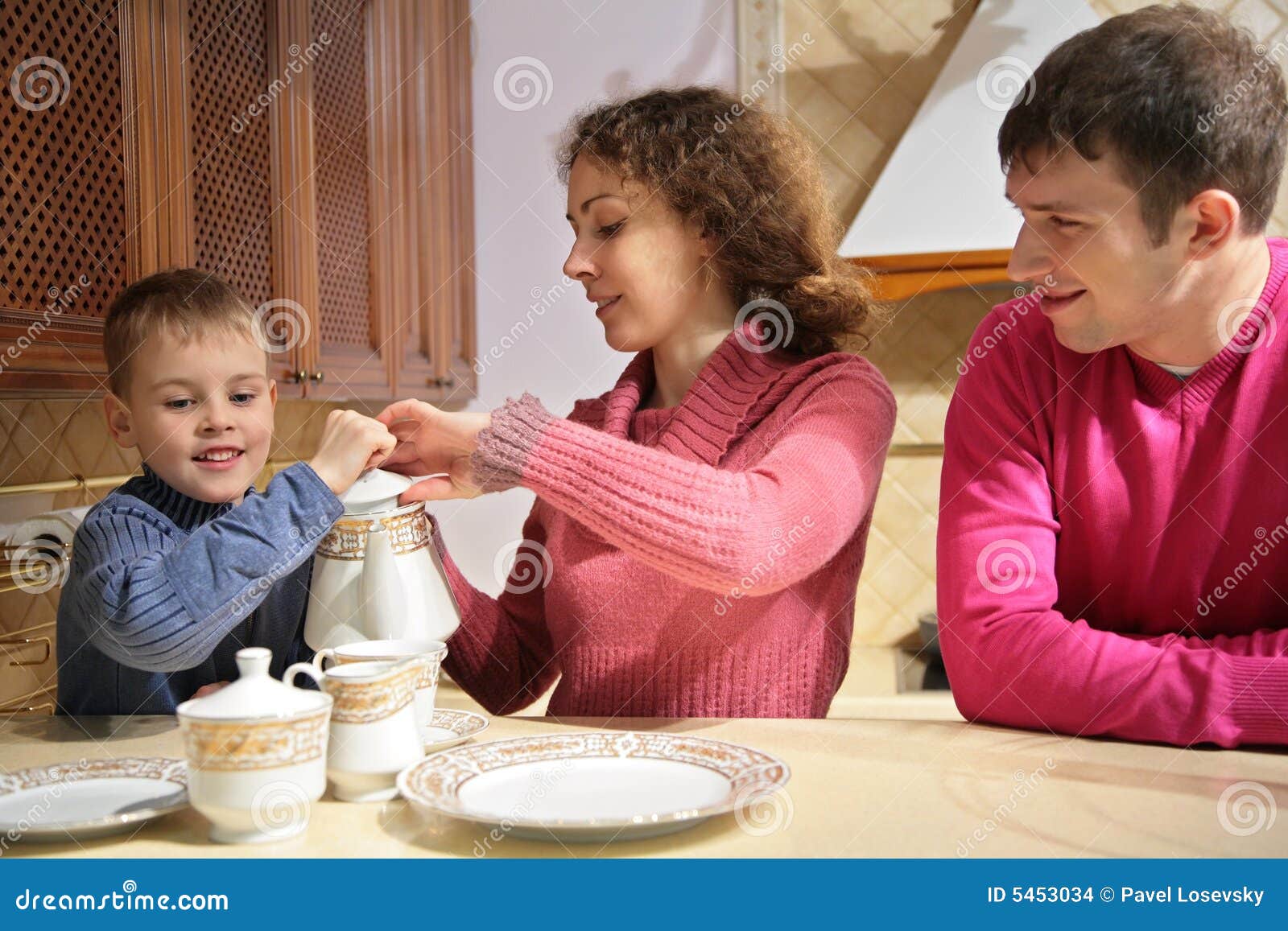 Parents with son at tea stock photo. Image of family, morning - 5453034