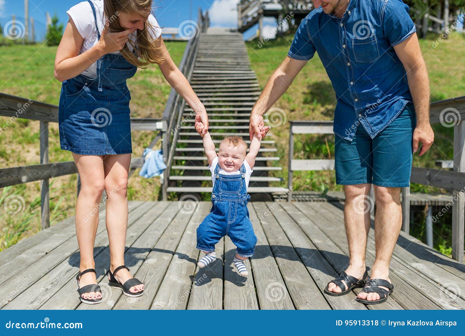 Parents Teaching Baby Boy To Walk Stock Photo - Image of parent, happy ...