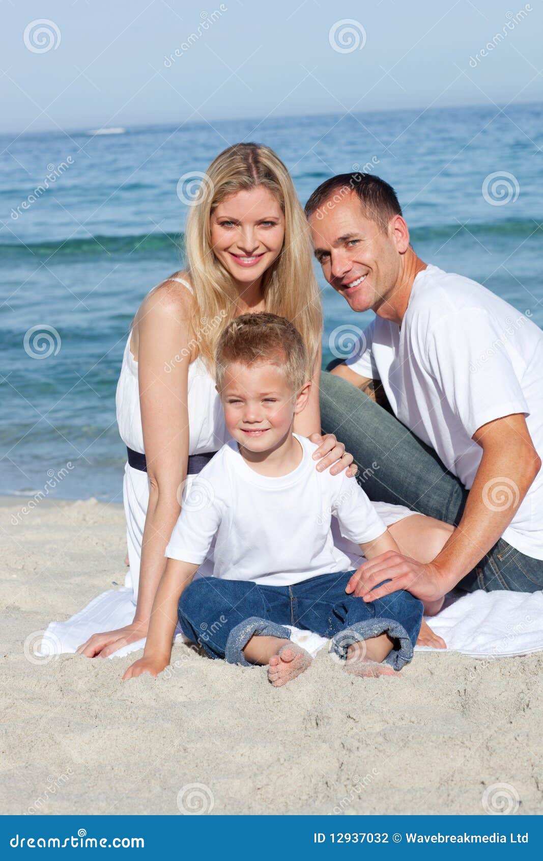Parents with Their Son Sitting on the Sand Stock Photo - Image of smile ...