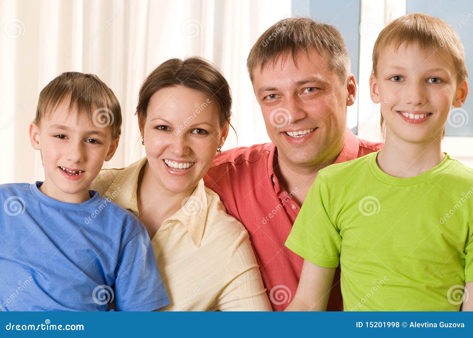 Parents with Their Two Children Stock Photo - Image of home, background ...