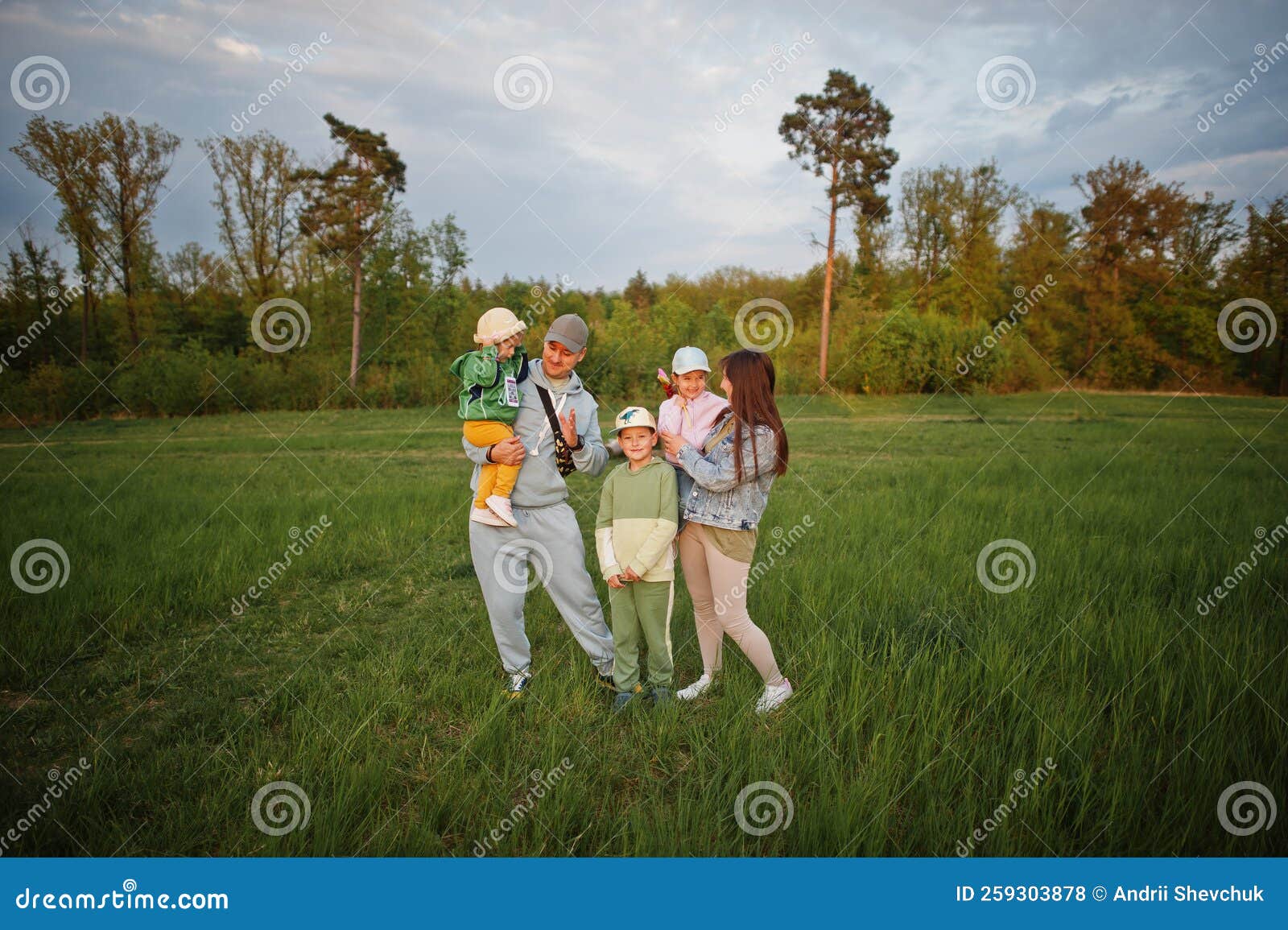 Parents with Three Kids Having Fun Together at Meadow Stock Photo ...