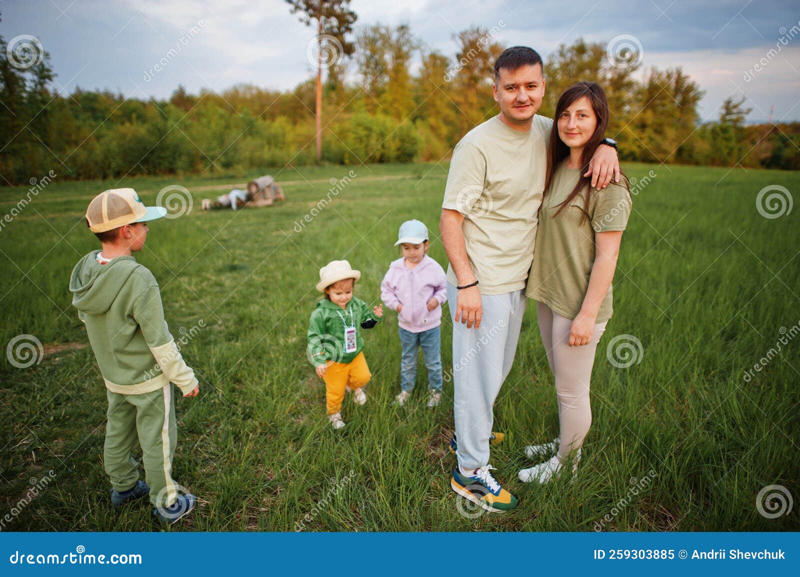 Parents with Three Kids Having Fun Together at Meadow Stock Image ...