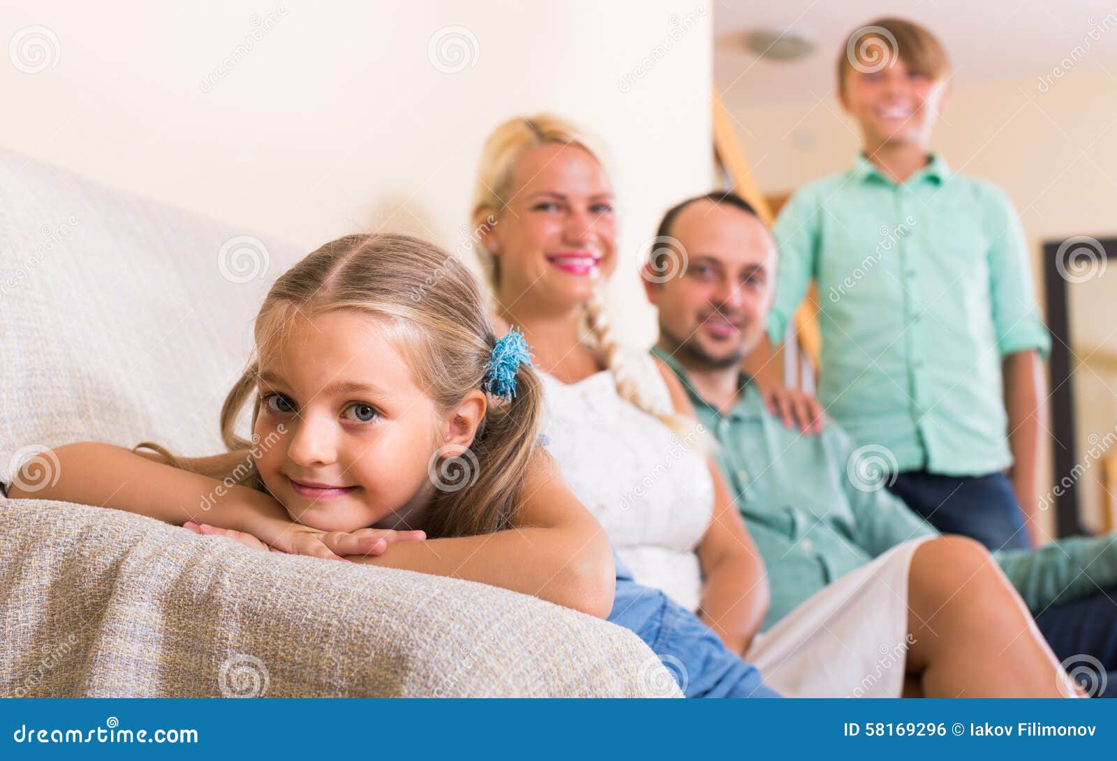 Parents with Two Children Posing in Home Interior Stock Photo - Image ...