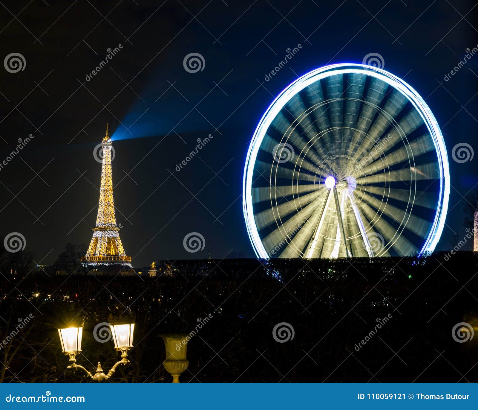 The Eiffel Tower and the Ferris Wheel at Night in Paris, France ... The Eiffel Tower and the Ferris Wheel at Night in Paris, France ...