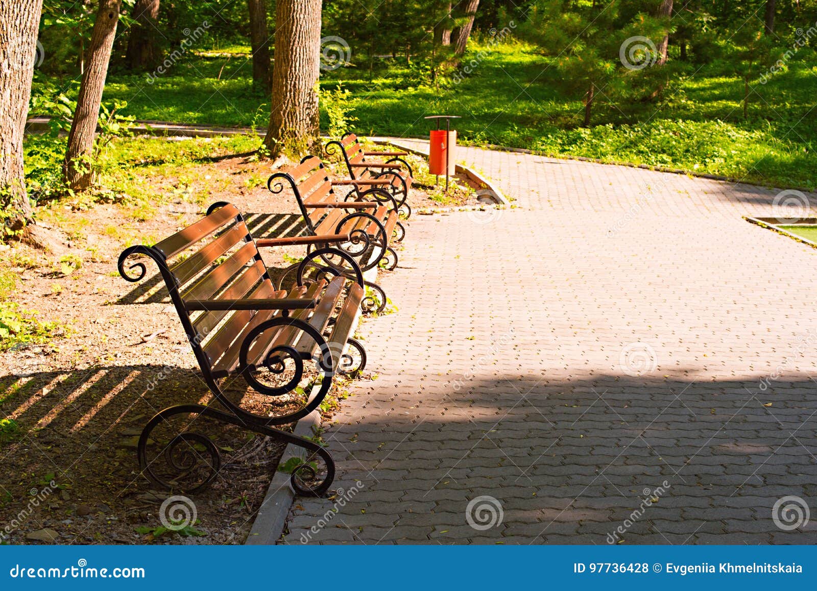 Park bench at sunset stock photo. Image of background - 97736428