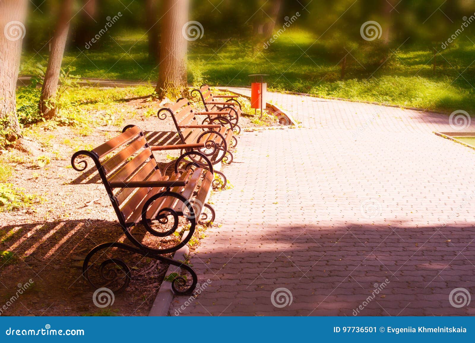 Park bench at sunset stock image. Image of background - 97736501