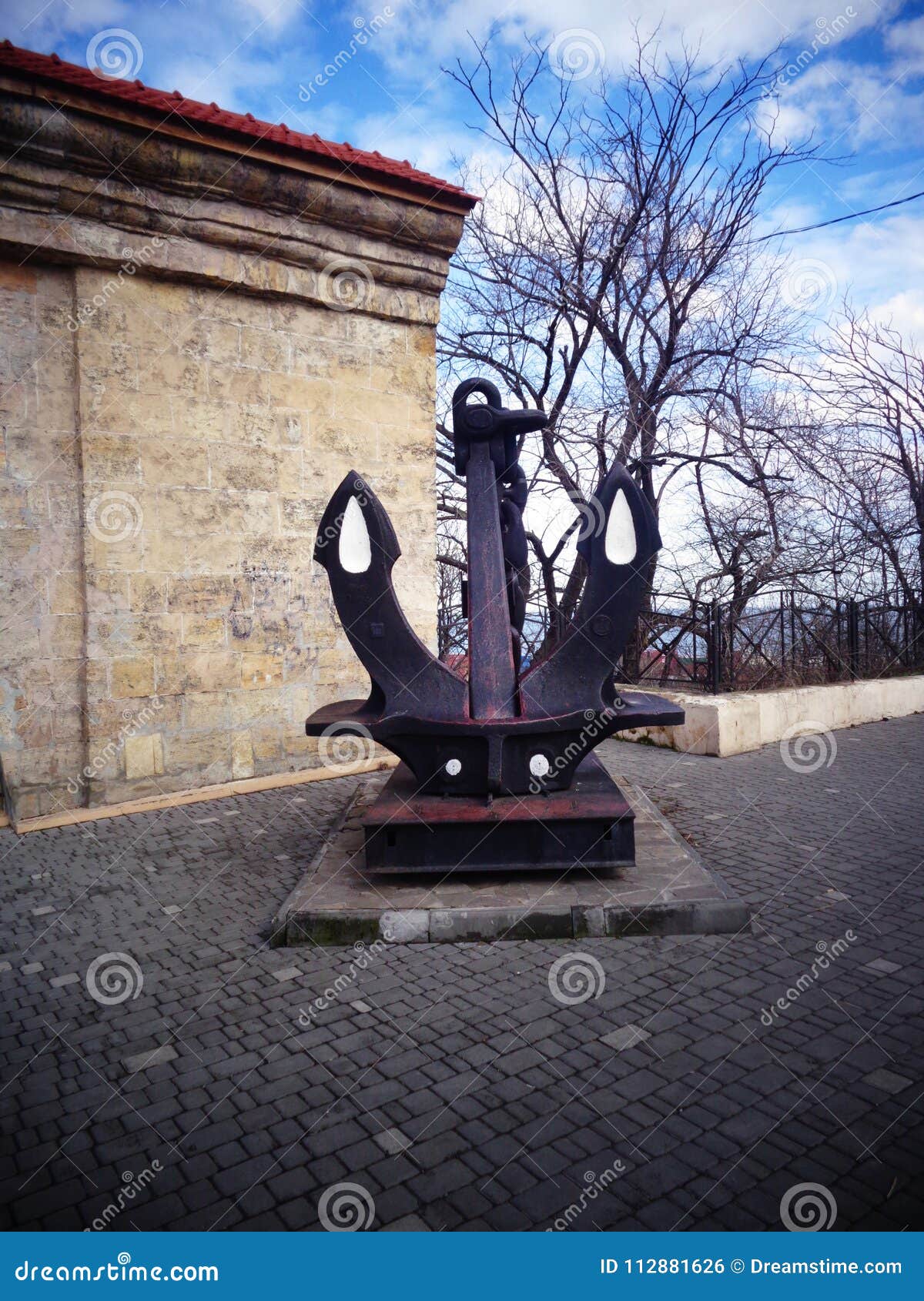 A Park Nautical Shipborne Anchor Pedestal Stock Photo - Image of ground ...