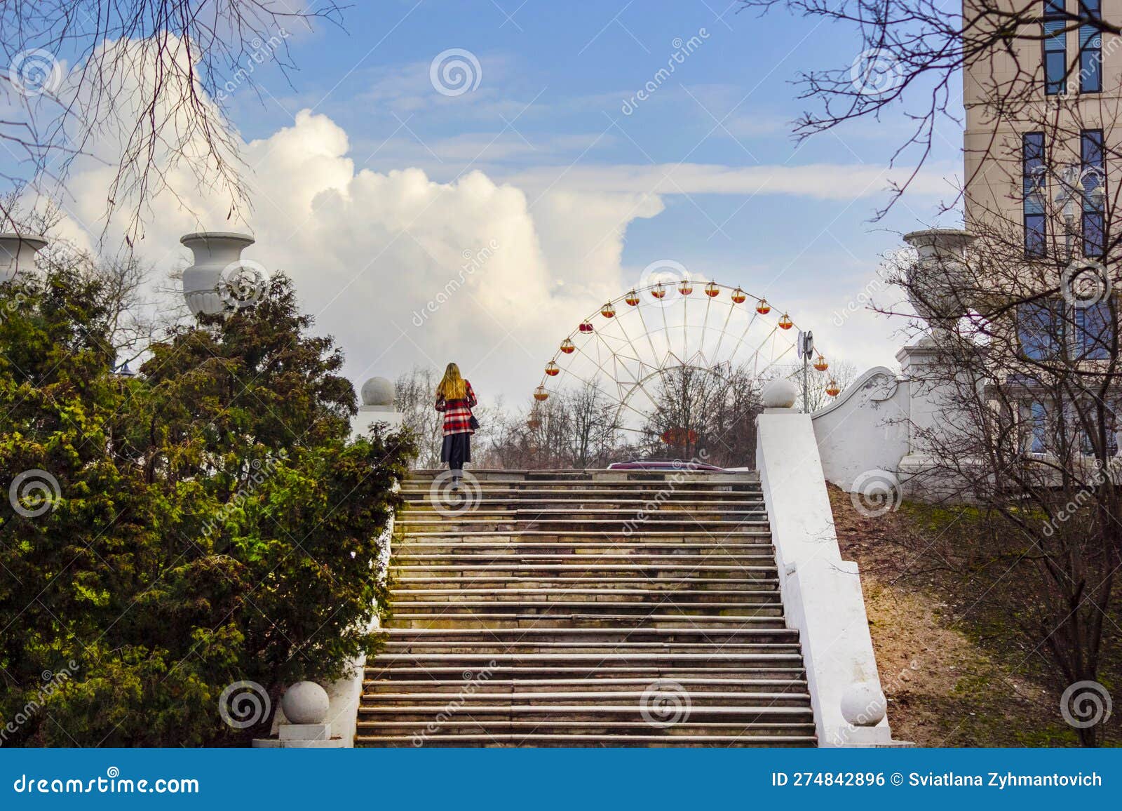 Park in Spring. Against the Backdrop of a Beautiful Staircase, a Ferris ...