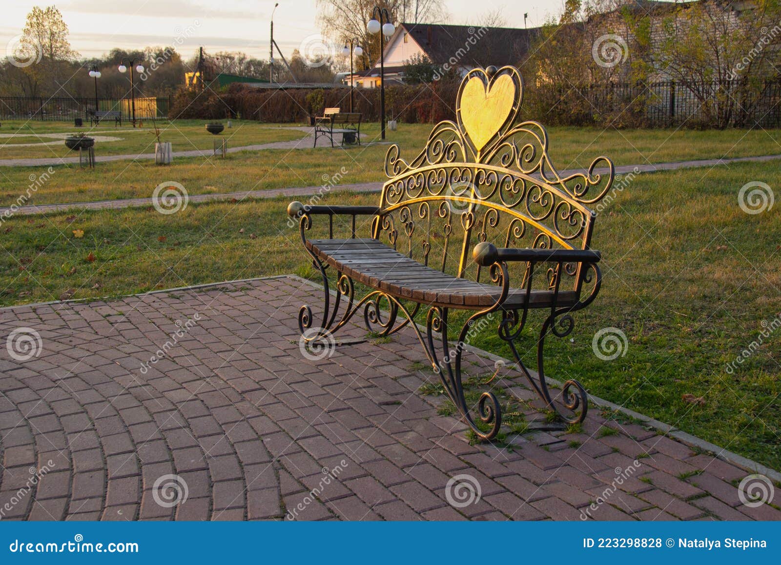 In the Park in the Summer There is a Concave Bench Trying on the Heart ...