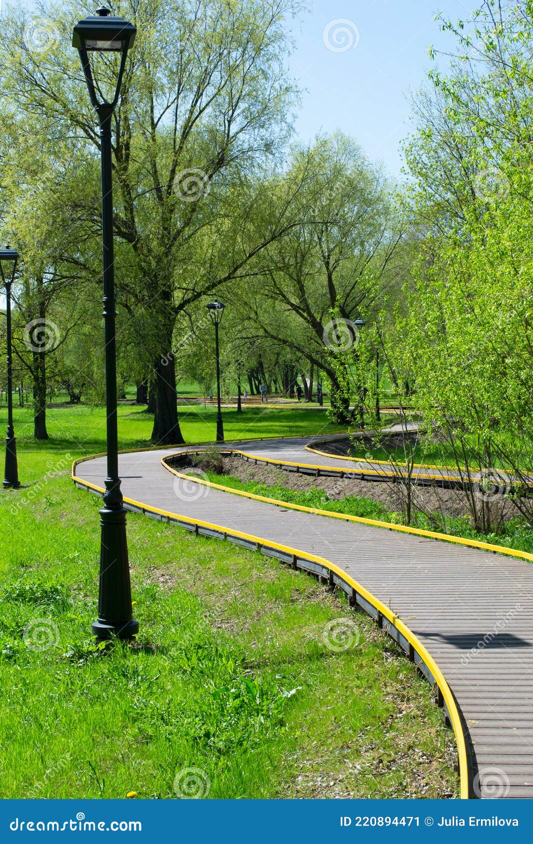 Park Walking Path with a Lantern in the Spring. Improvement of the Park ...