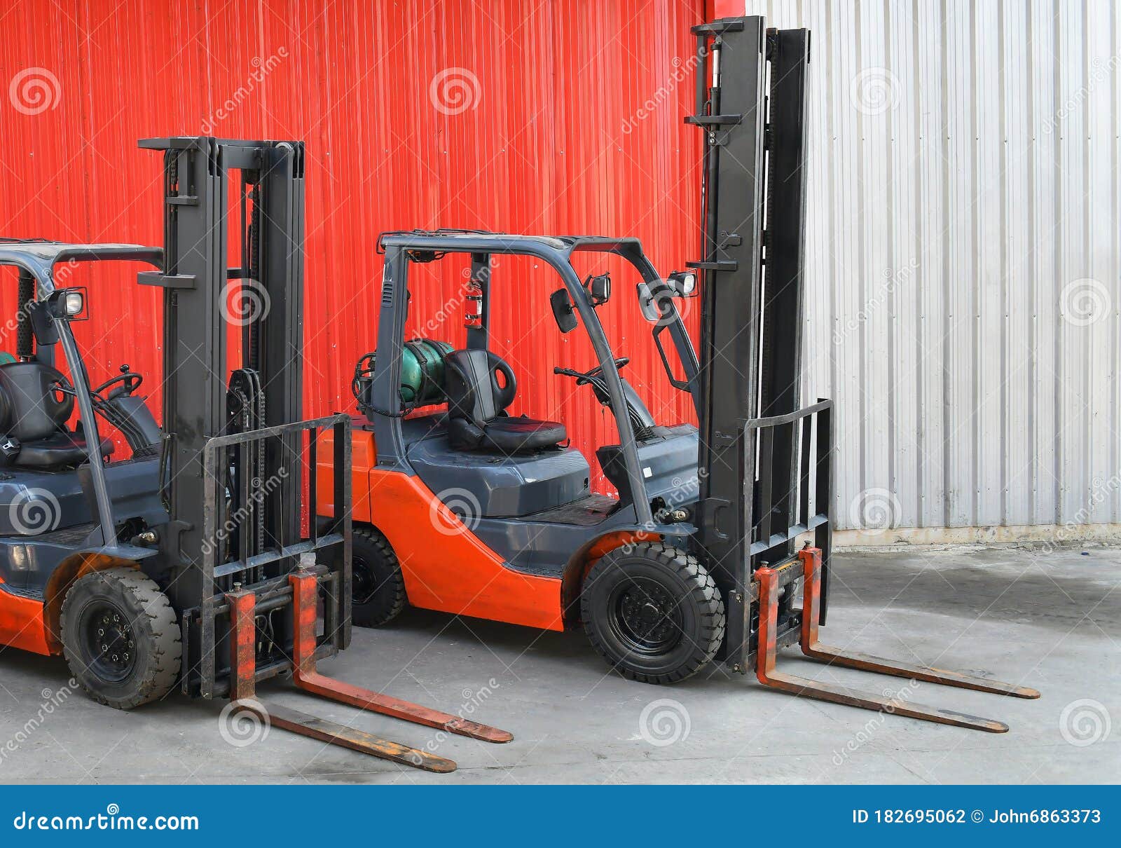 Parked Forklifts in Warehouse Front Stock Photo - Image of freight ...