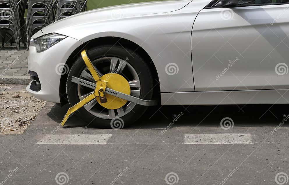 Parking Claw on a Car Front Wheel Stock Image - Image of punishment ...