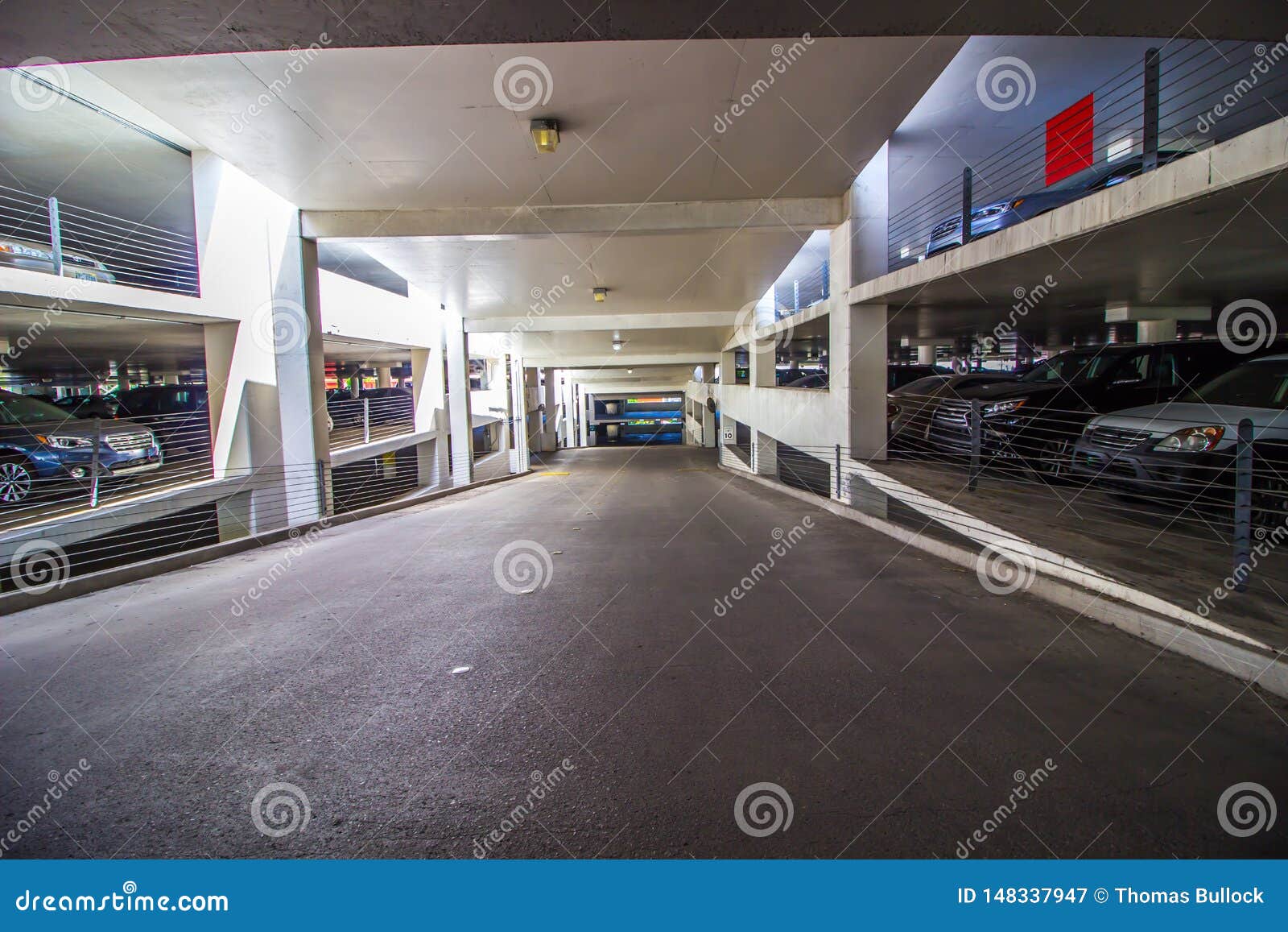 Ramp in Enclosed Parking Garage Stock Image - Image of exit, mirrors ...