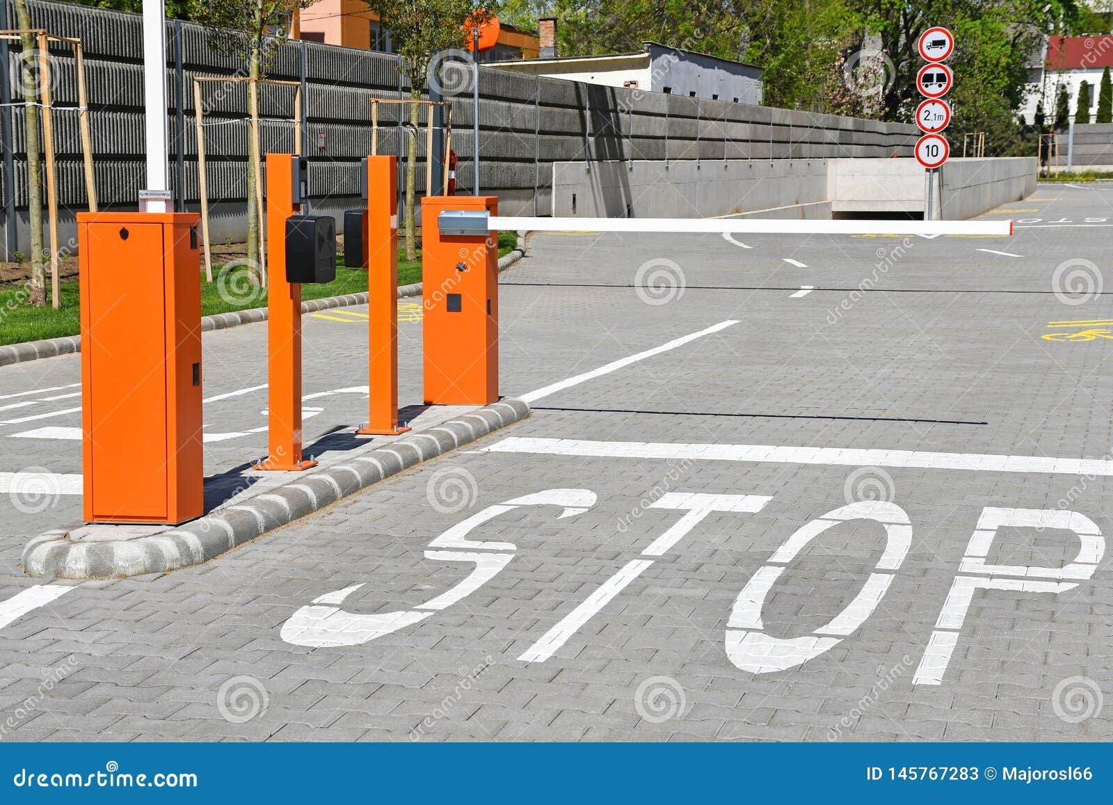 Parking Lot Gate and Stop Sign Stock Image - Image of garage, warning ...