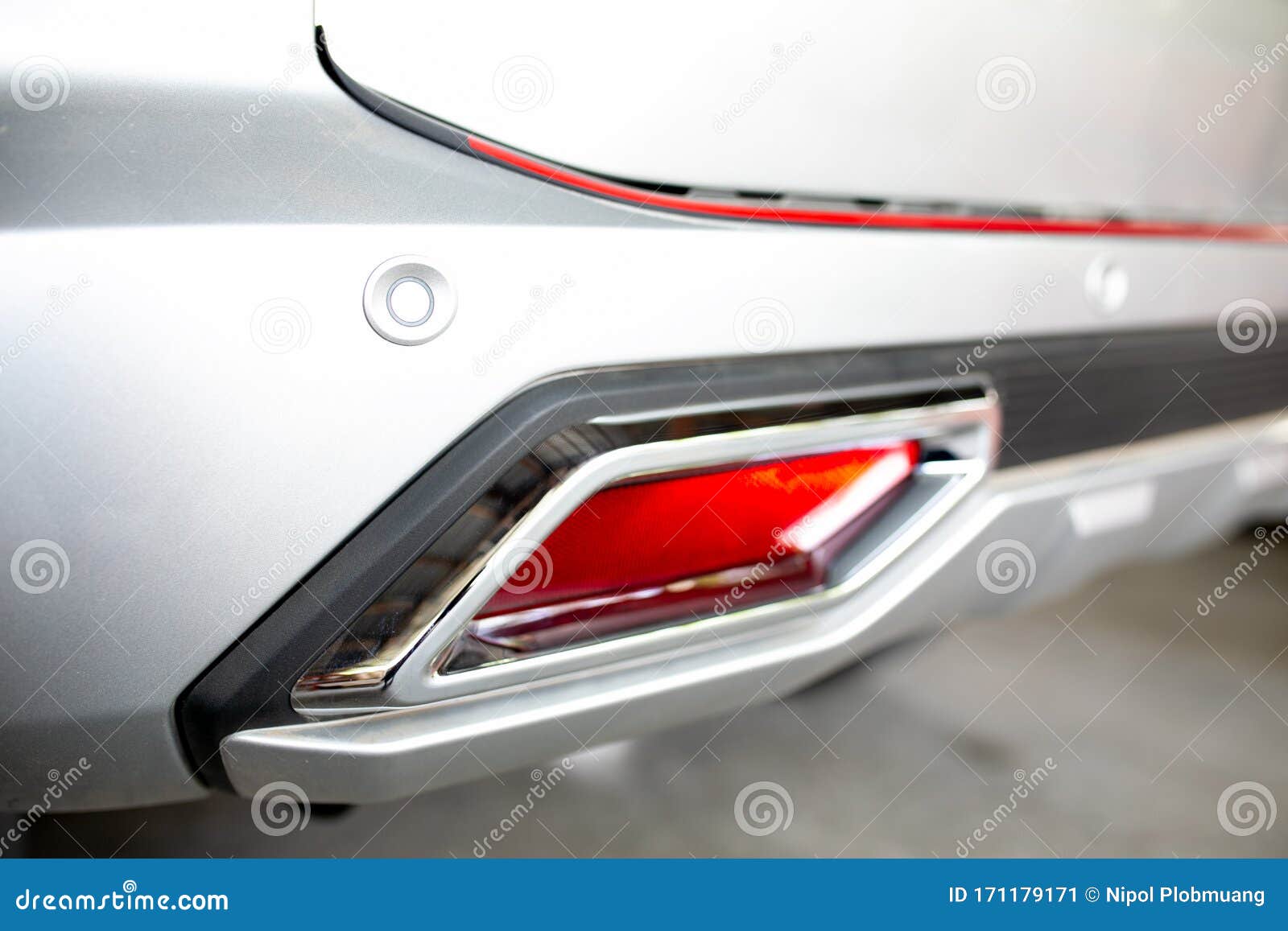 Parking Sensors On A White Car, Rear Bumper With Reflector And Exhaust ...