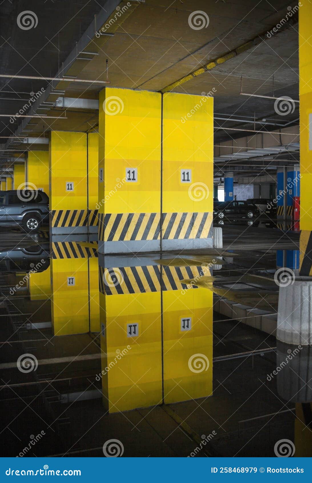 Parking under the building stock image. Image of puddle - 258468979