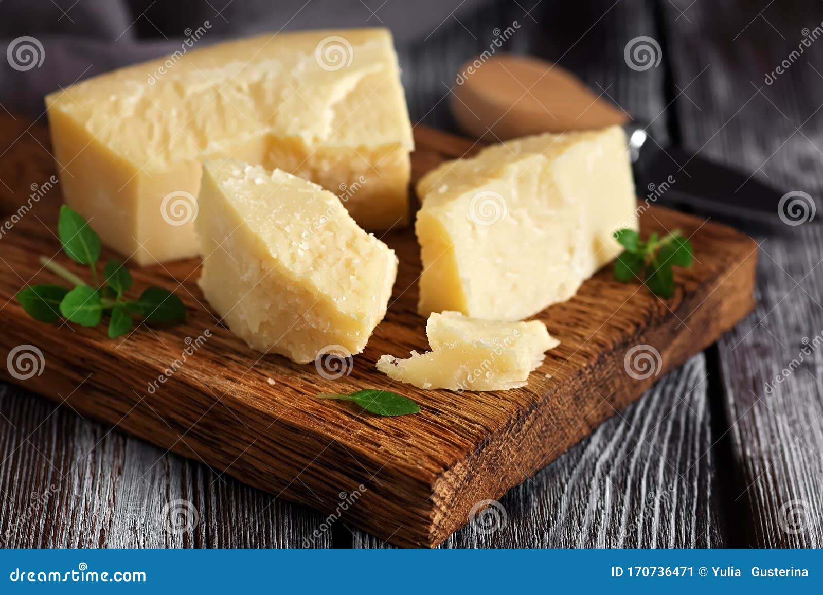 Parmesan Cheese on a Cutting Board with Basil Leaves, Rustic Wooden ...