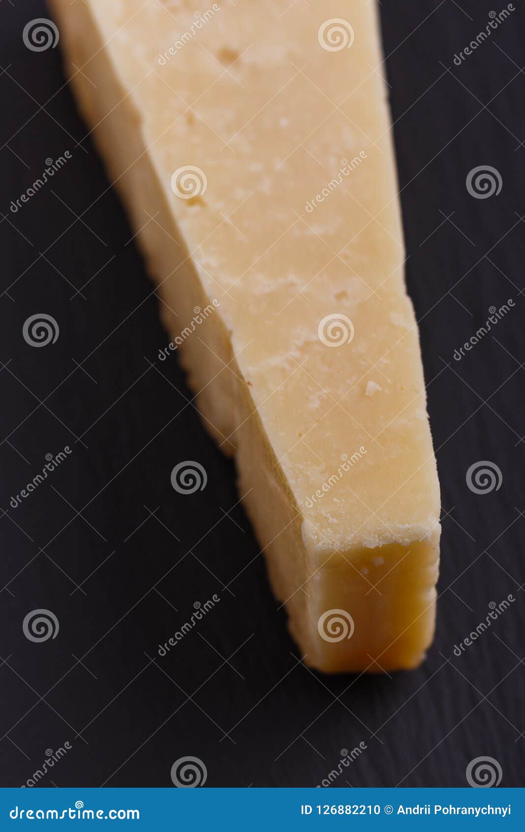 Parmesan Slice on a Stone Slate Plate Stock Photo - Image of gourmet ...