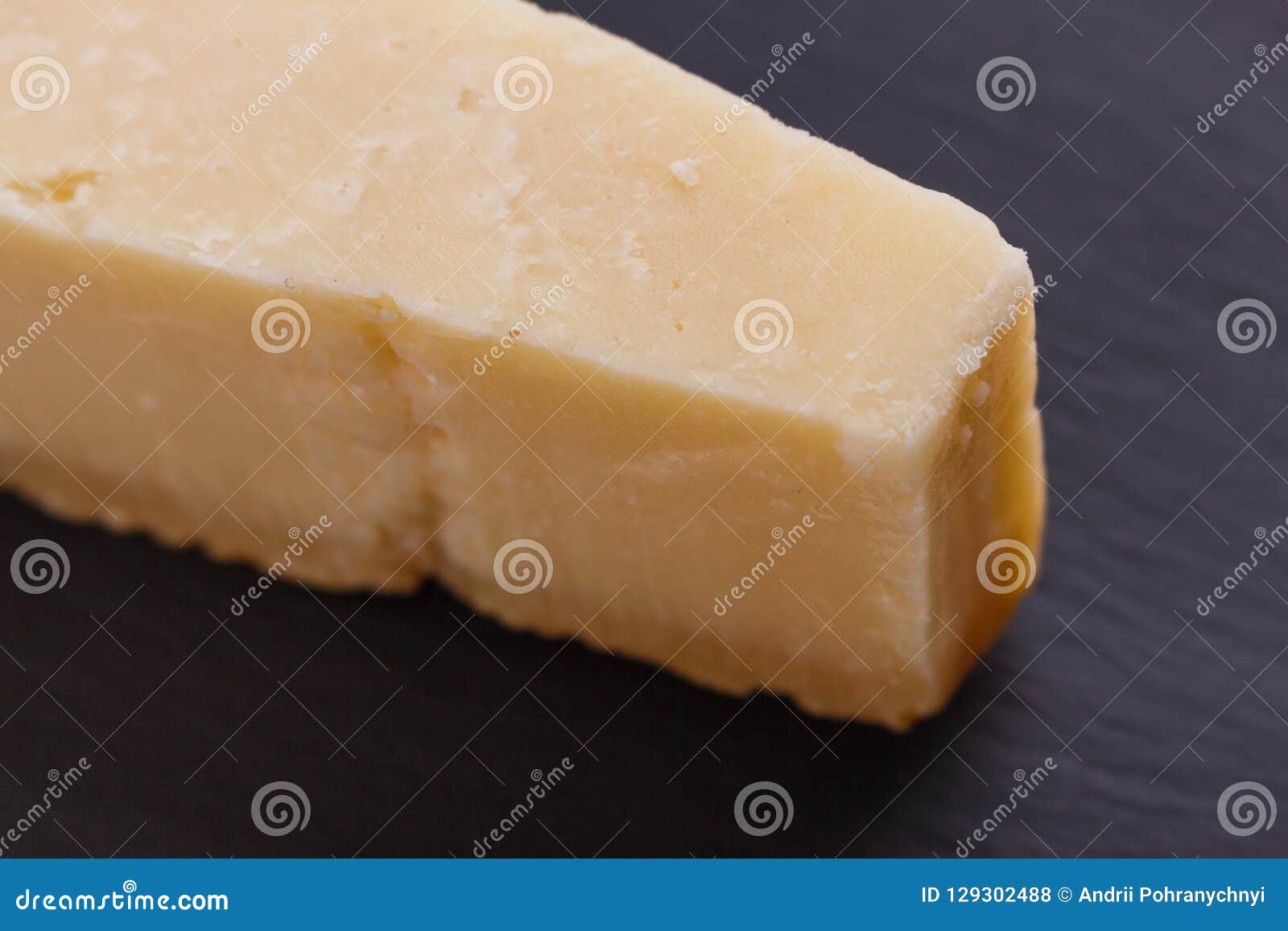 Parmesan Slice on a Stone Slate Plate Stock Photo - Image of piece ...