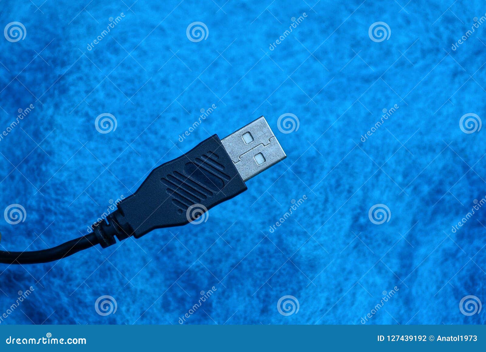 Part of a Black Computer Cord on a Blue Background Stock Photo - Image ...
