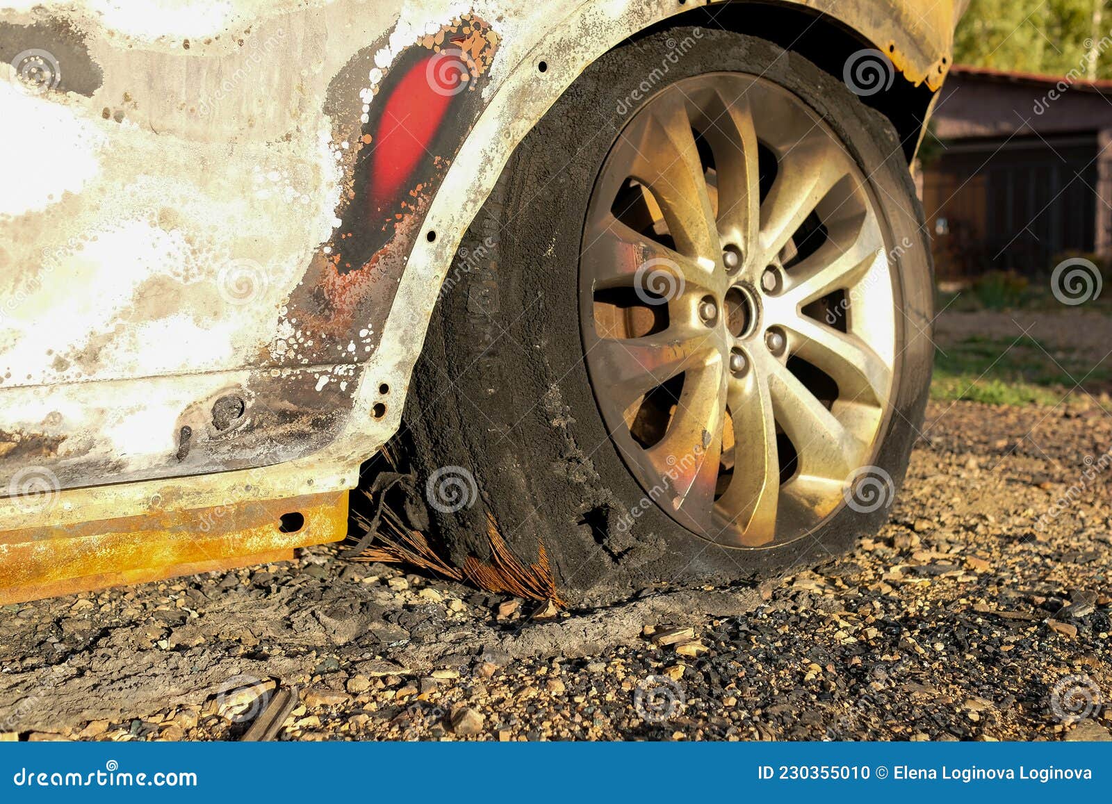 Part of the Car after a Fire. Burnt Wheel and Rubber Stock Photo ...