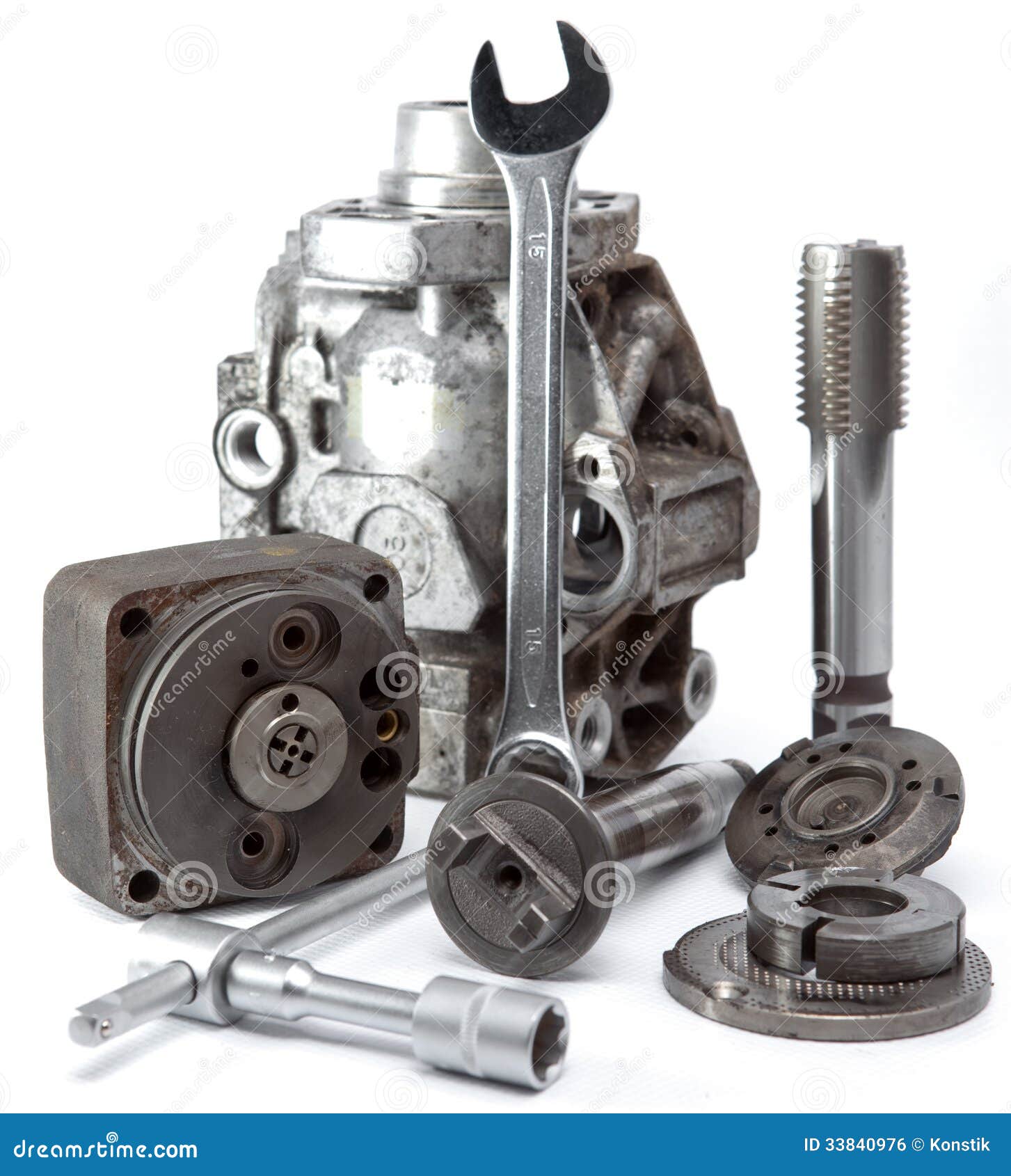 The Part of Car High Pressure Pump and the Tool for Repair on a White ...