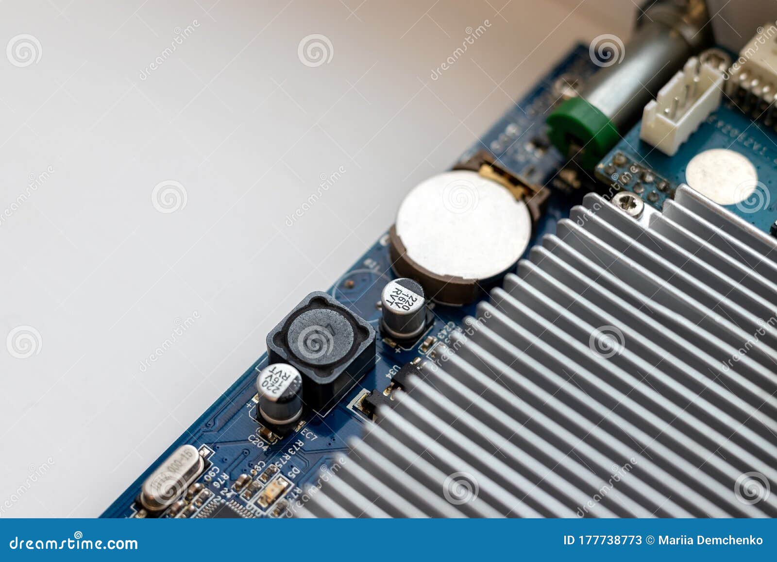 Part of a Computer Motherboard with Capacitors, a Battery and a Cooling ...