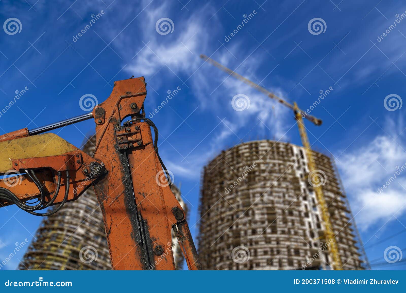 Part of a Construction Machine with Multi-storey Building Under ...