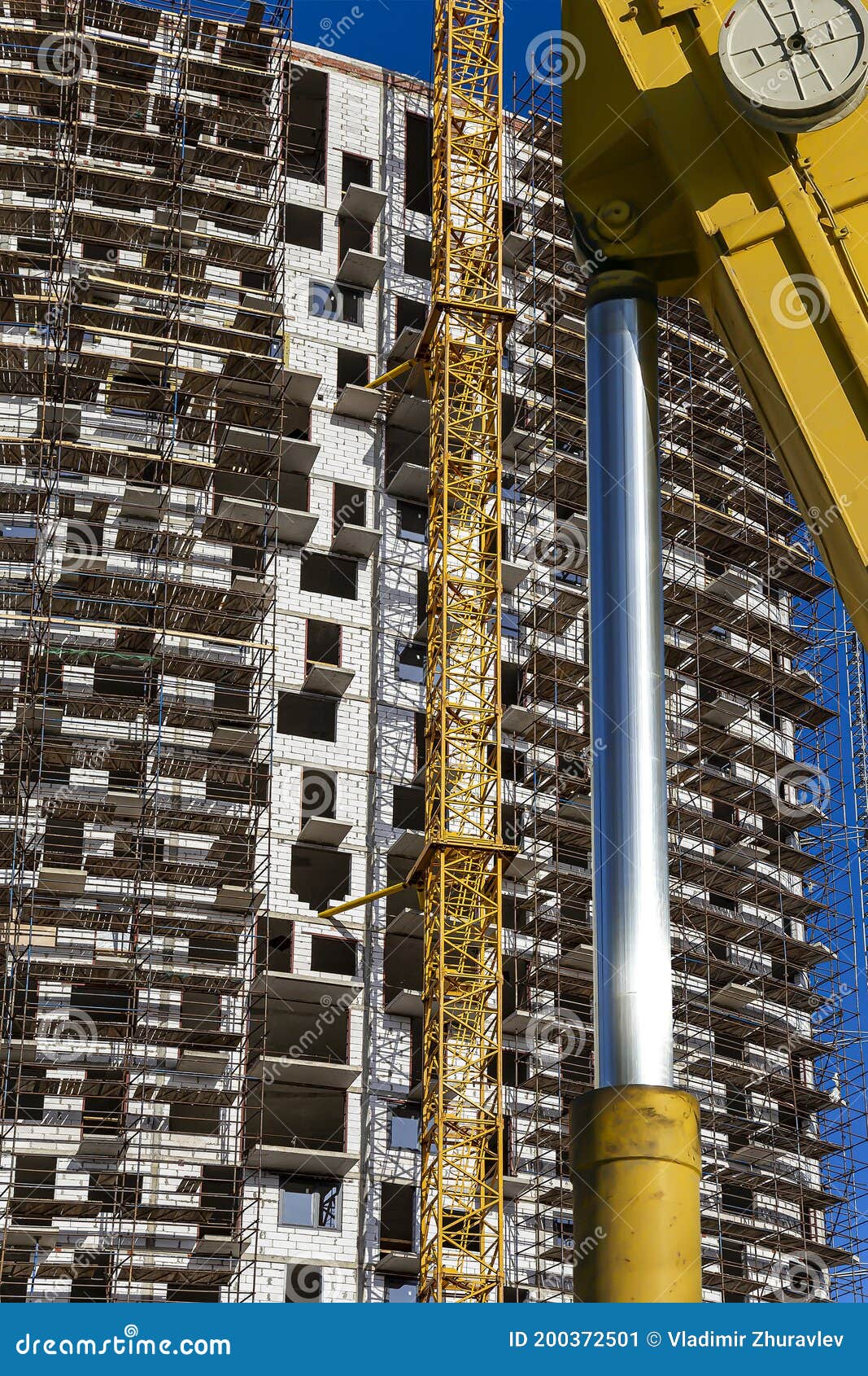 Part of a Construction Machine with Multi-storey Building Under ...