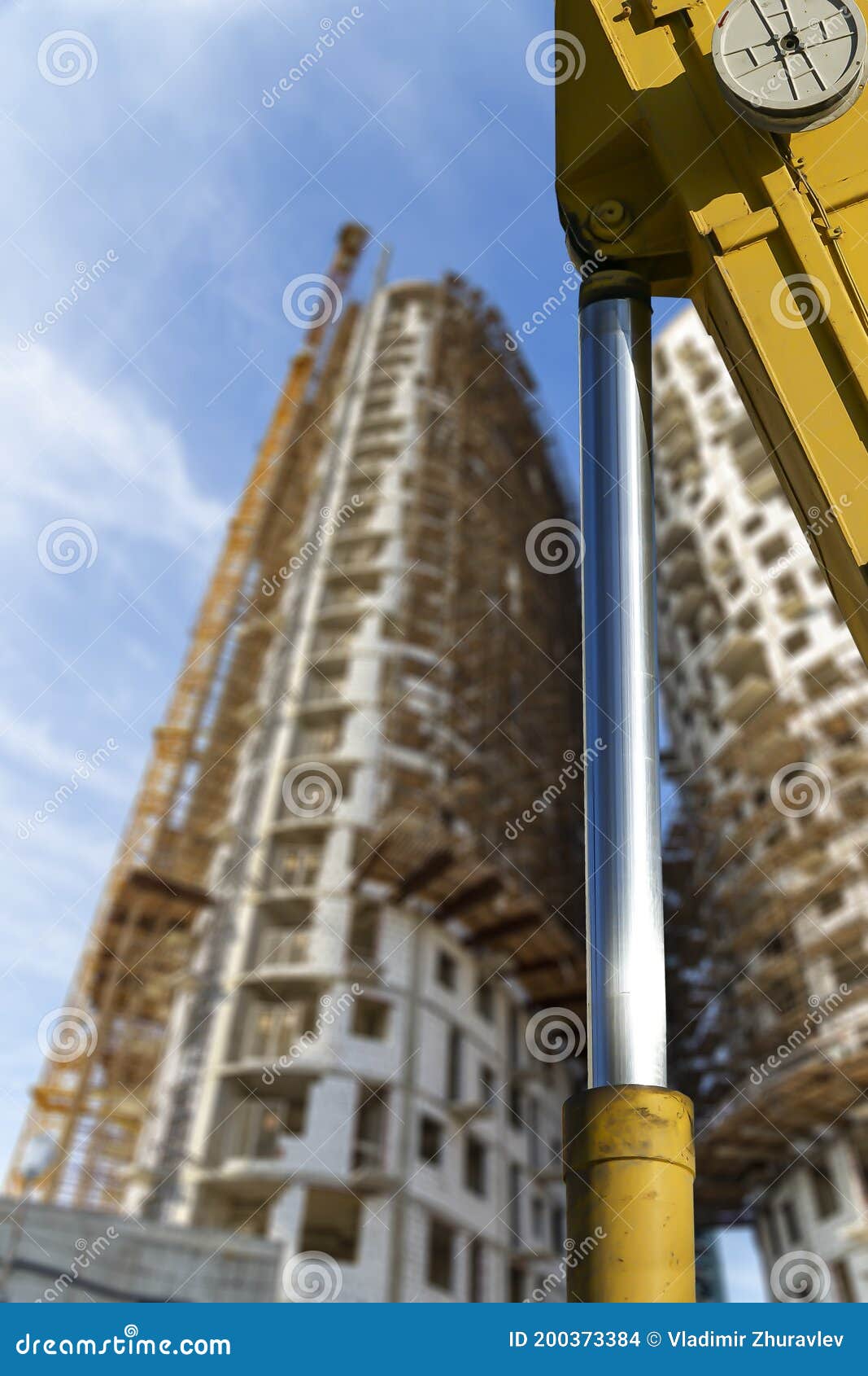 Part of a Construction Machine with Multi-storey Building Under ...