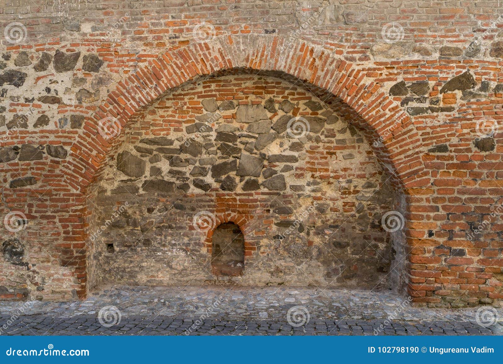 Brick and Stone Medieval Wall with an Arch Stock Photo - Image of ...