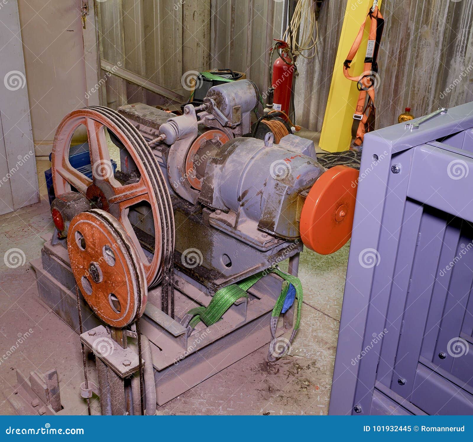 Part of Industrial Lift. Pulley Wheel and Engine in Engine Room Stock ...
