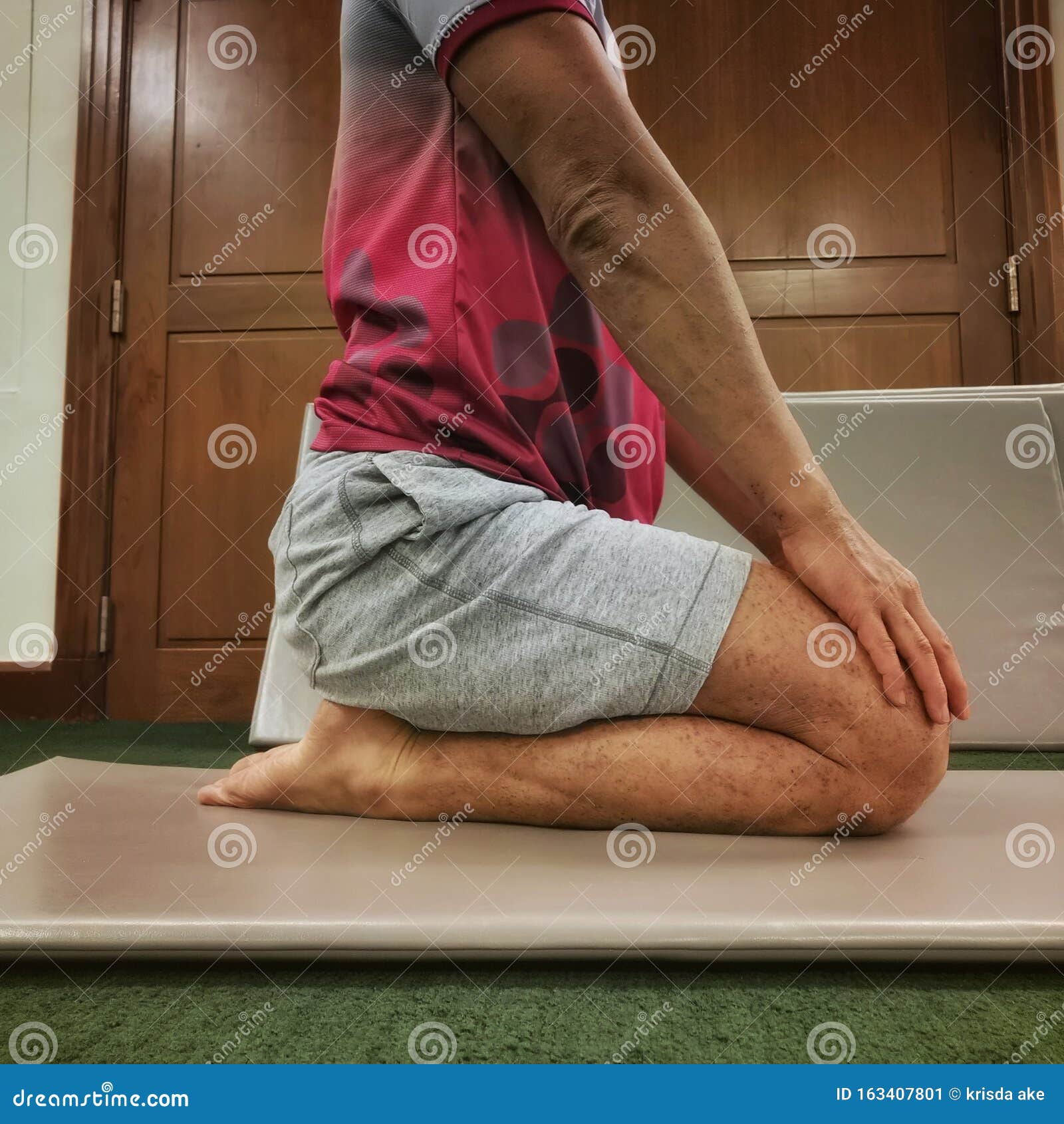 The Part of the Legs of Men Practicing Yoga Exercise on Mat Stock Image ...