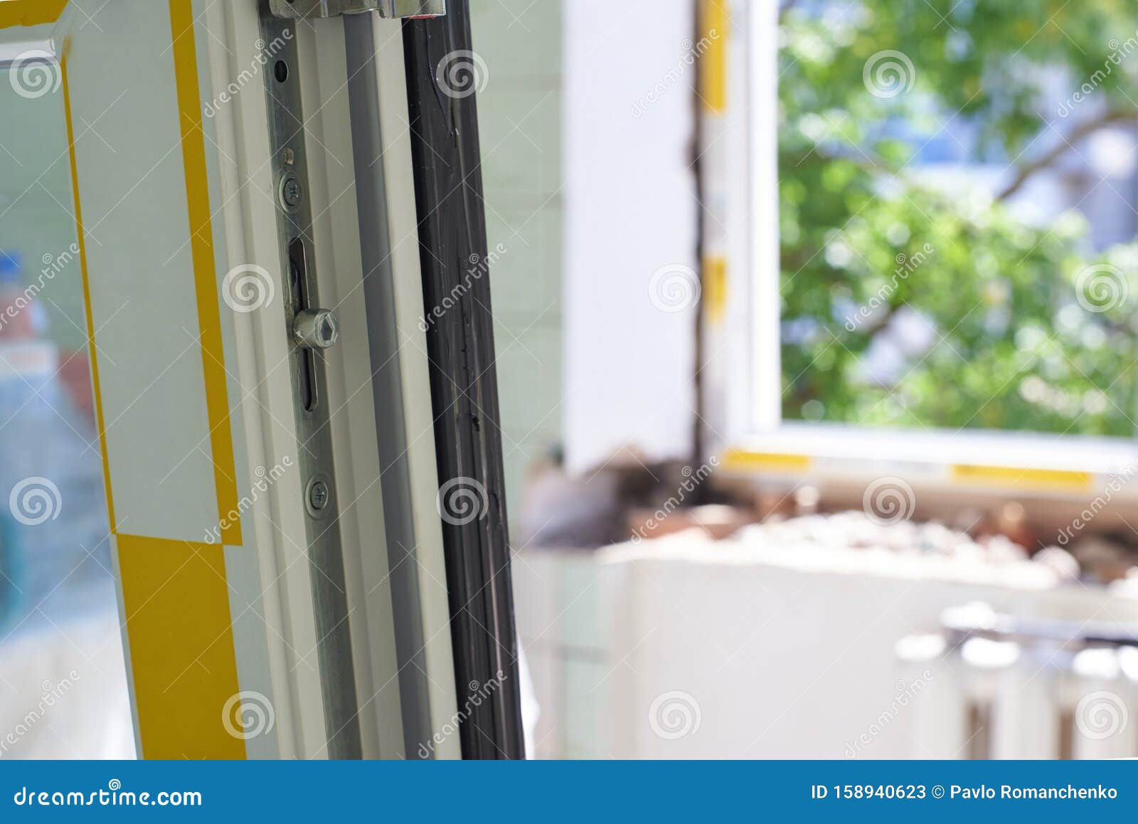 Part of the New Plastic Window in the Foreground, Installation of a ...