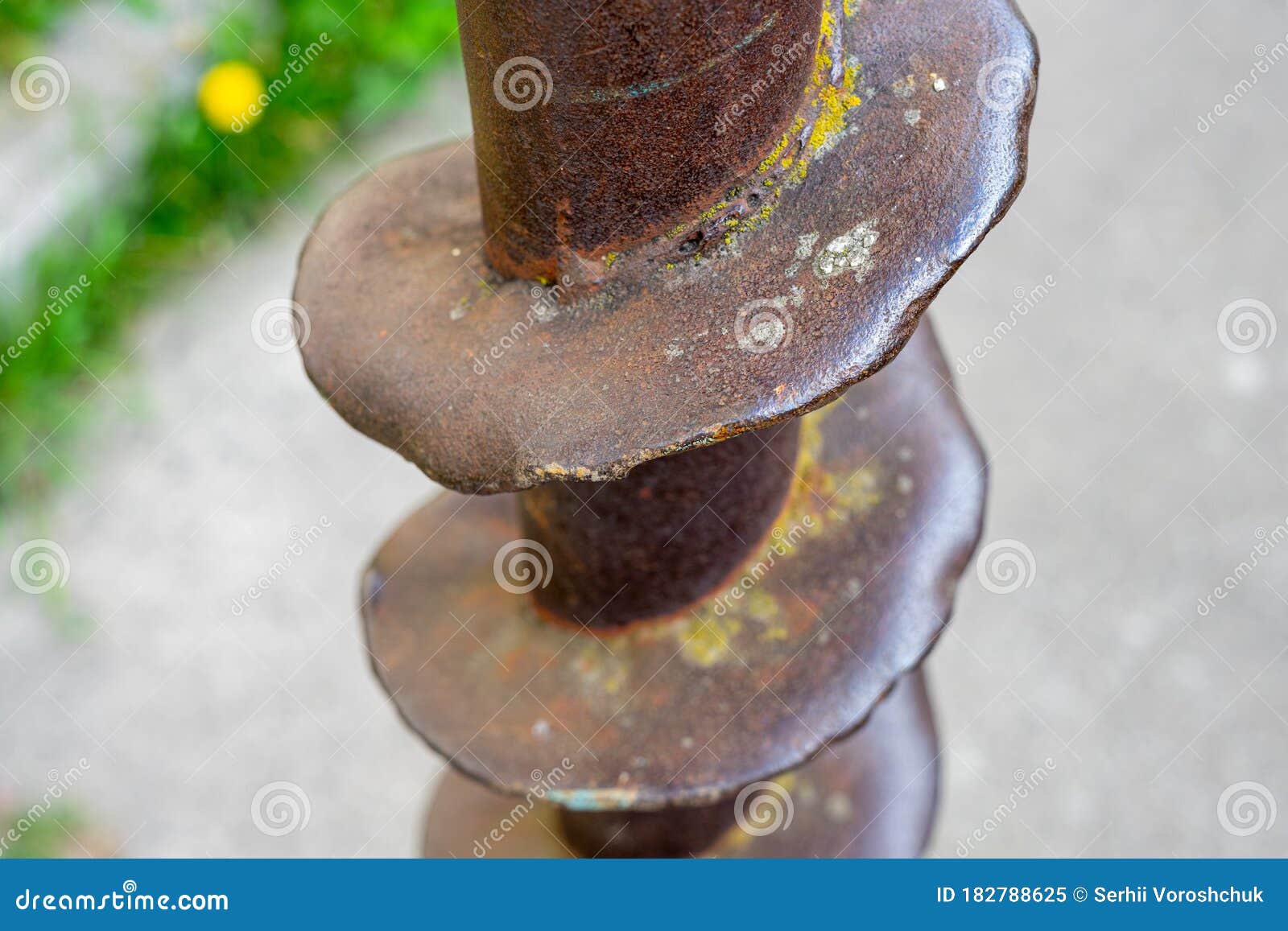 Part of an Old Rusty Drill Drilled into the Ground . Metal Rusty Drill ...