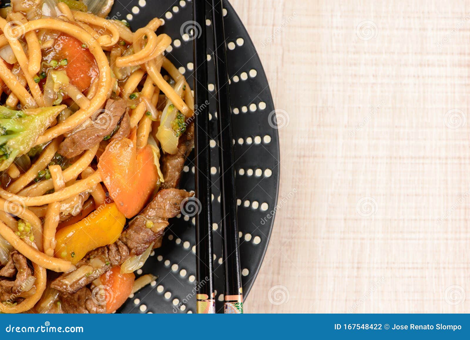Part of a Plate of Yakisoba on Light Wood Table with Space for Writing ...