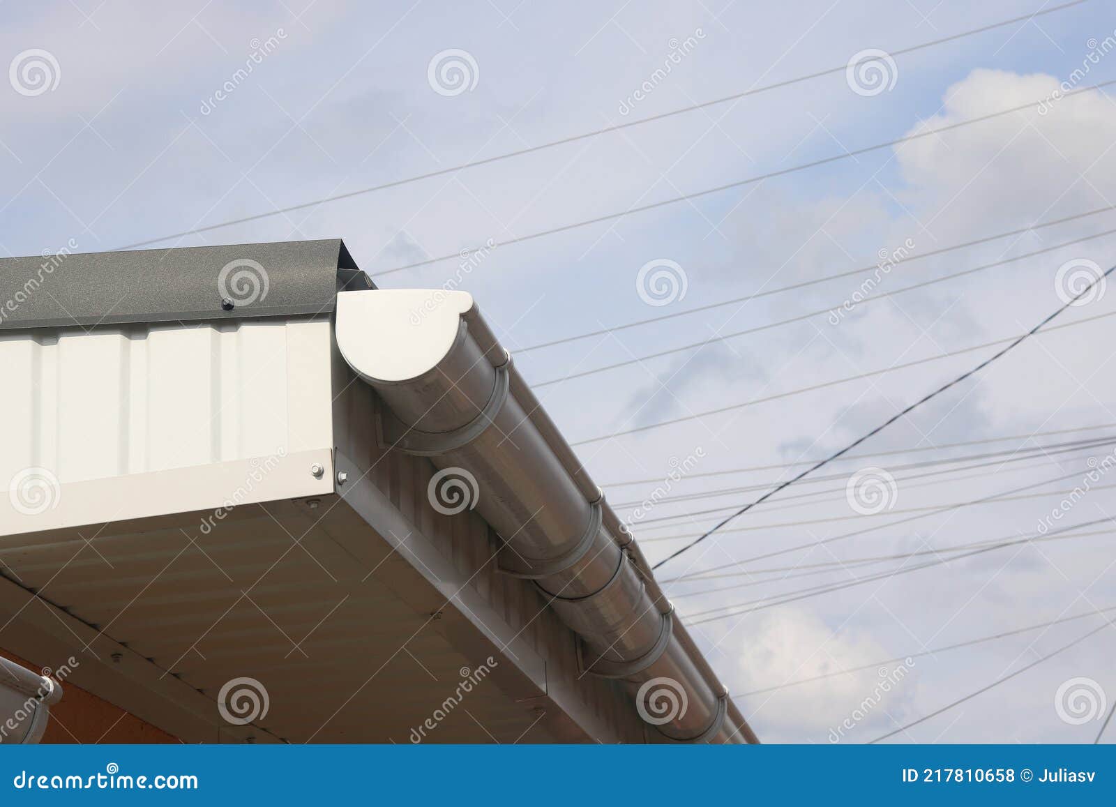 Part of Roof with Plastic Gutter Against Cloudy Sky Stock Photo - Image ...