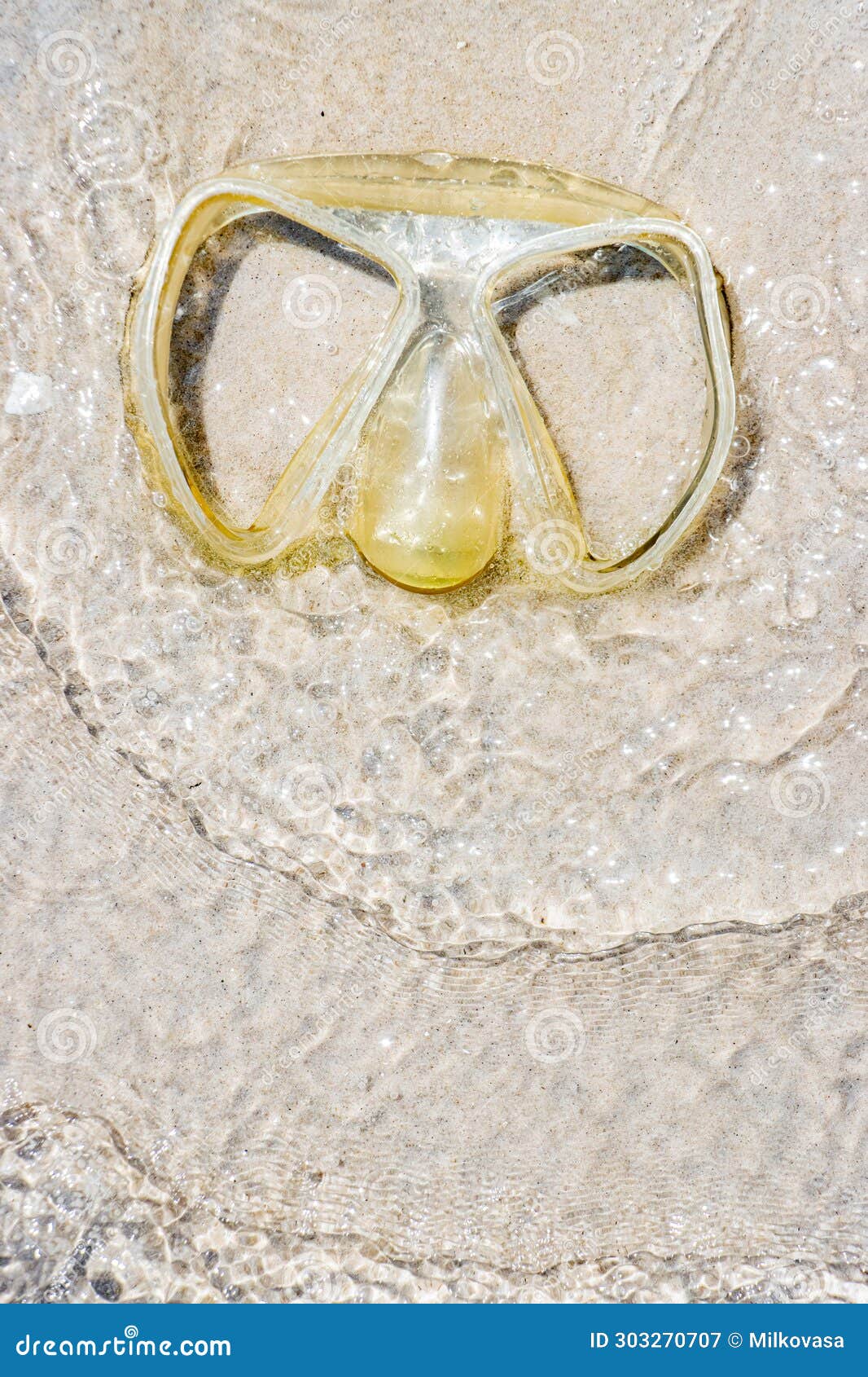 A Part of Snorkel Goggles Lying in the Sand on the Sea Beach Stock ...