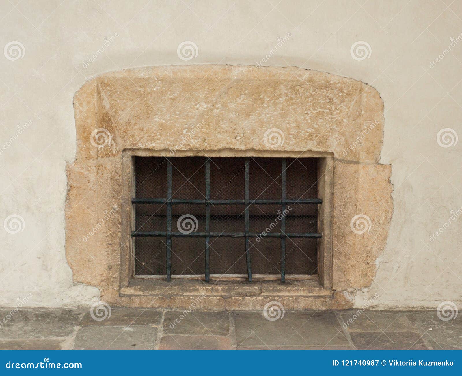 Part of the Wall of an Ancient Castle with Windows with Bars. Stock ...
