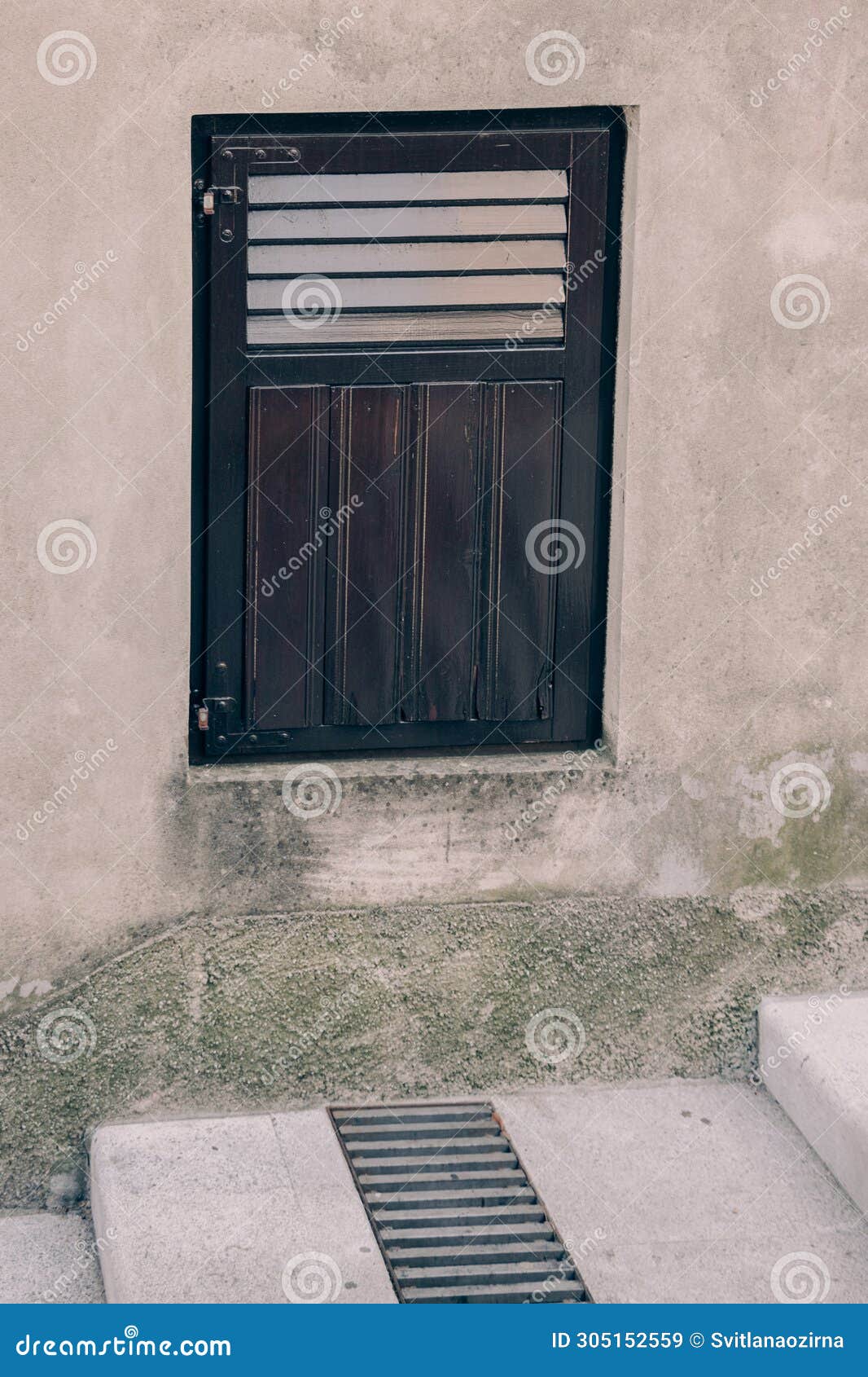 Part of the Wall of an Old House with Ventilation Grille and Guttering ...