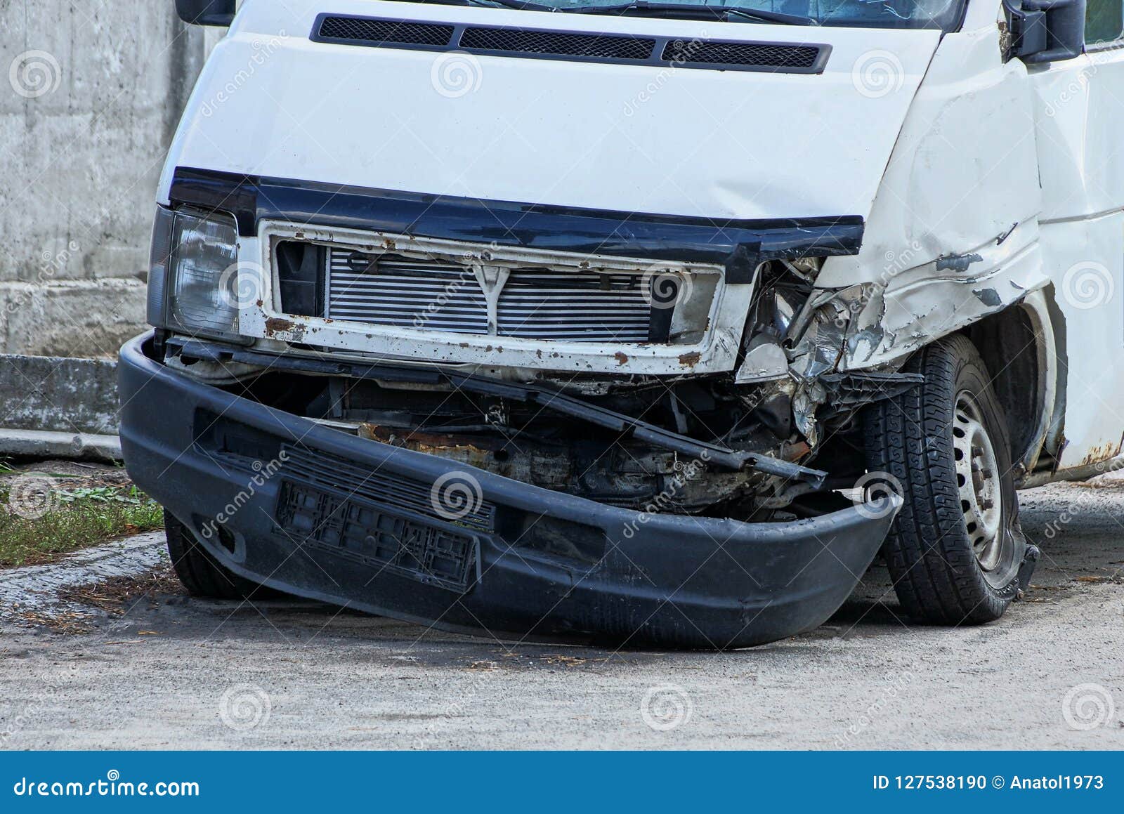 Part of the White Bus after the Accident with a Broken Bumper and ...