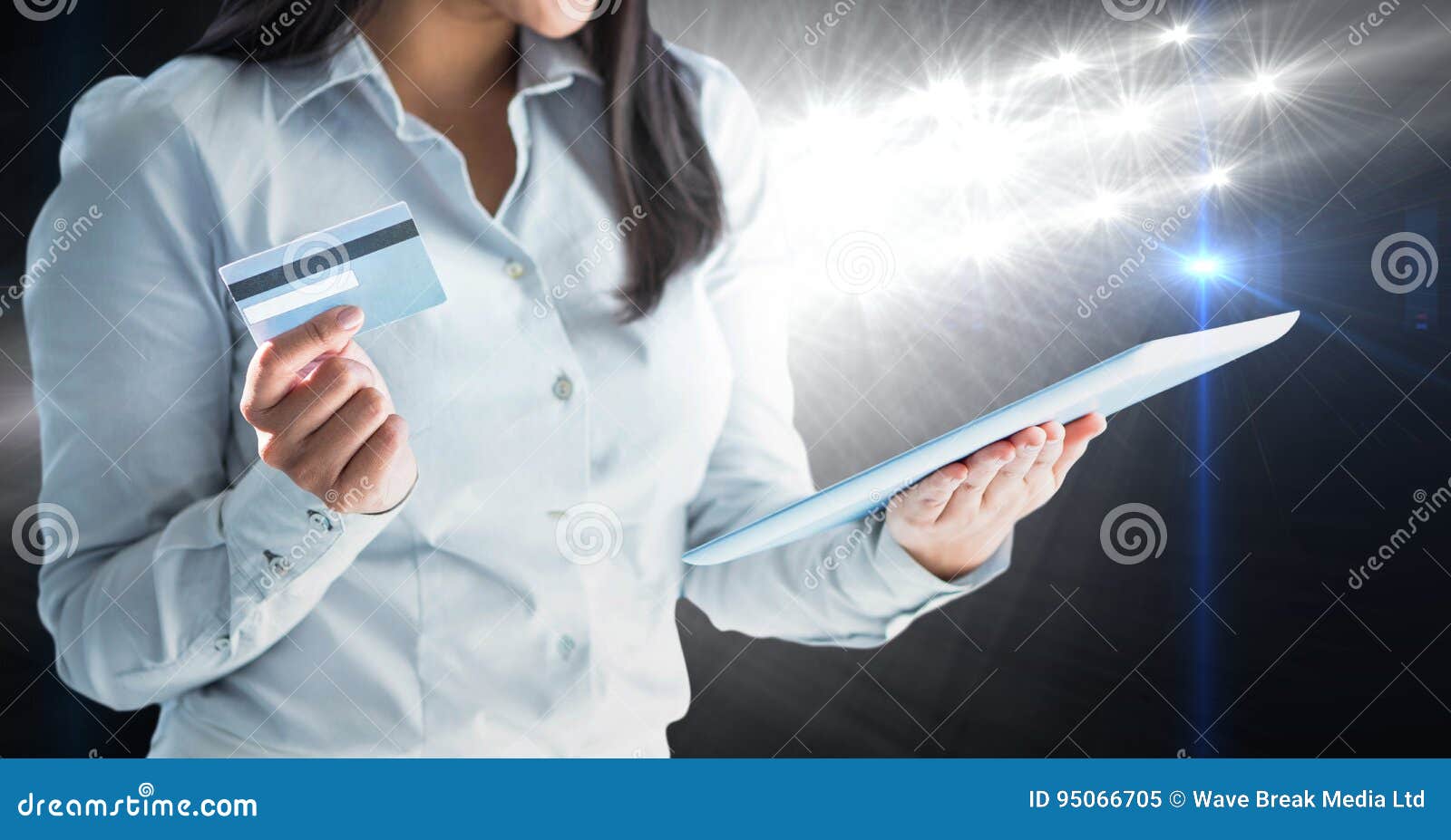Part of a Woman Watching a Digital Tablet Screen Holding a Debit Card ...