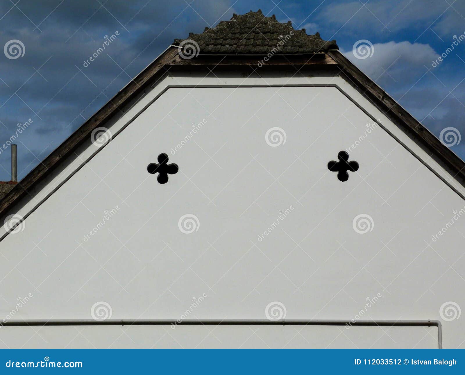 Partial Elevation of Building Attic with Artistic Vents Stock Photo ...