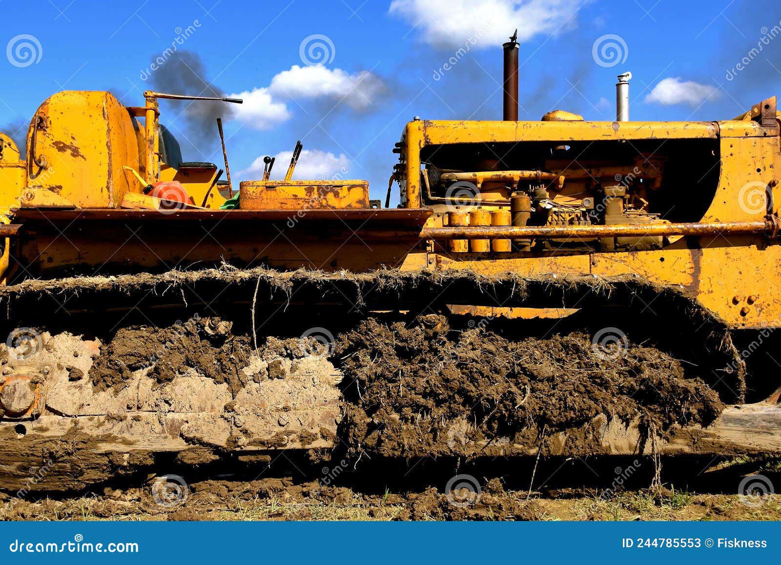 Side Profile of an Old Bulldozer with Tracks Full of Earthen Material ...