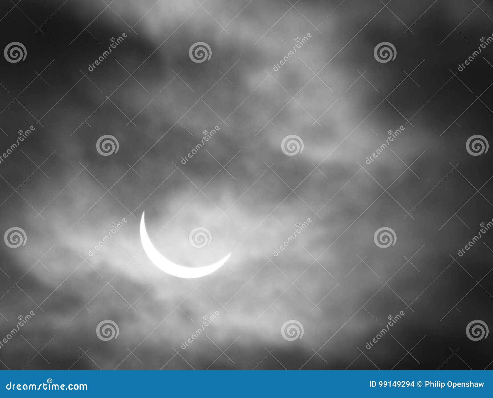 Partial Solar Eclipse with Sun through Clouds Stock Photo - Image of ...