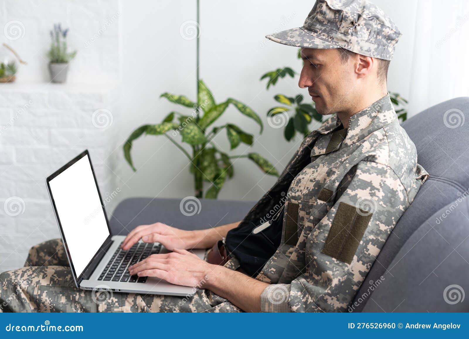 Partial View of Army Soldier Using Laptop on Couch Stock Photo - Image ...